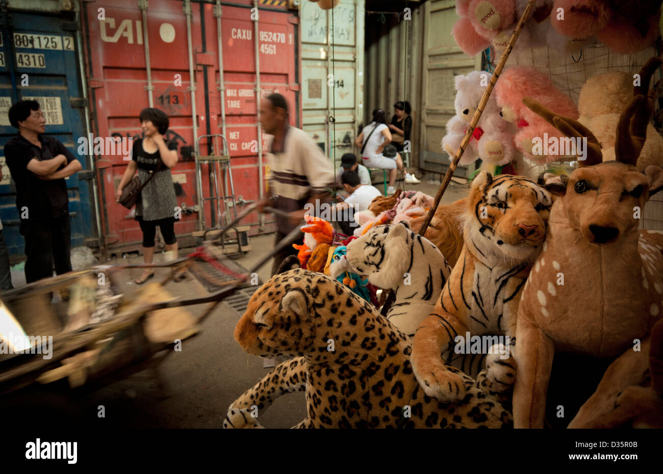 Chinese merchants selling items from shipping containers in Karasuu ...