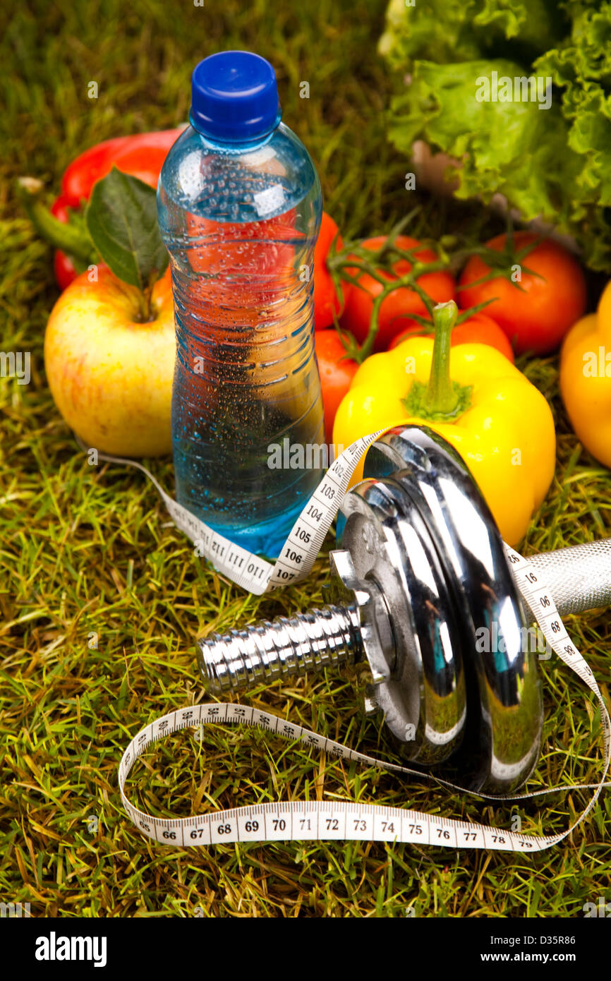 Measuring of dumbbell, fruits and vegetables Stock Photo - Alamy