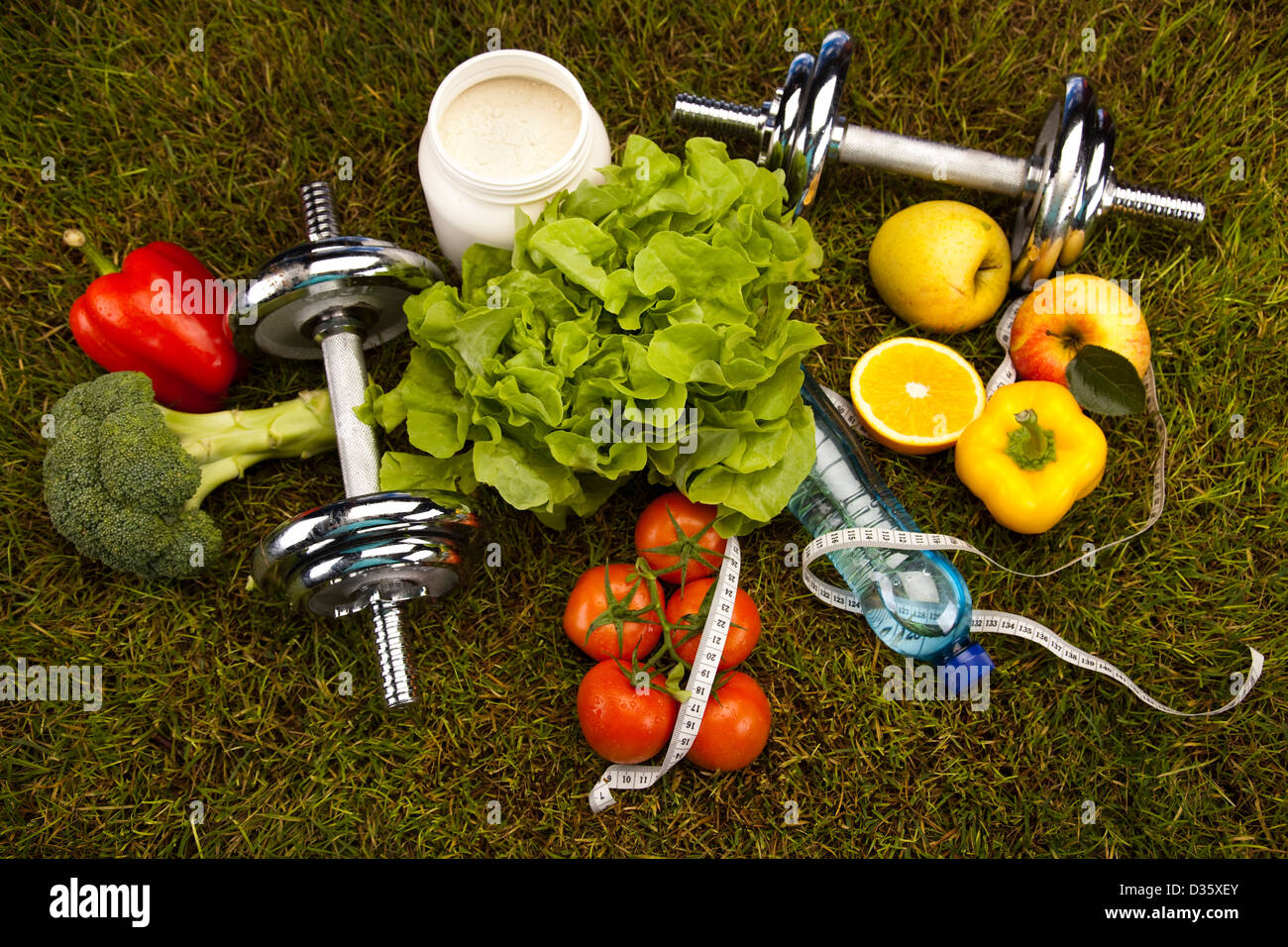 Measuring of dumbbell, fruits and vegetables Stock Photo - Alamy