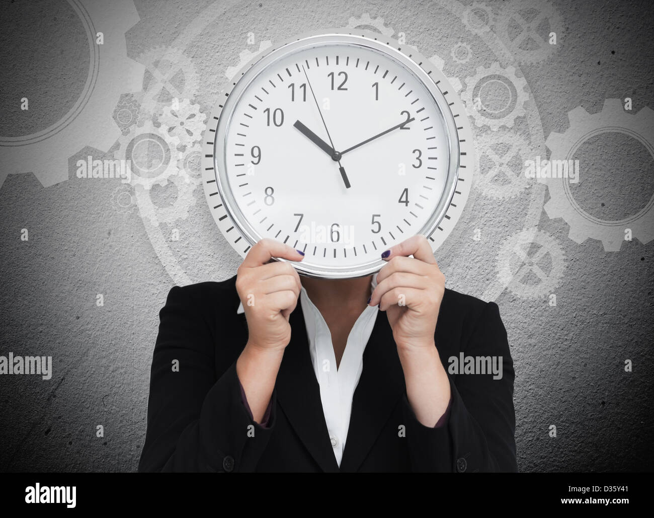 Businesswoman hiding her face with clock Stock Photo - Alamy
