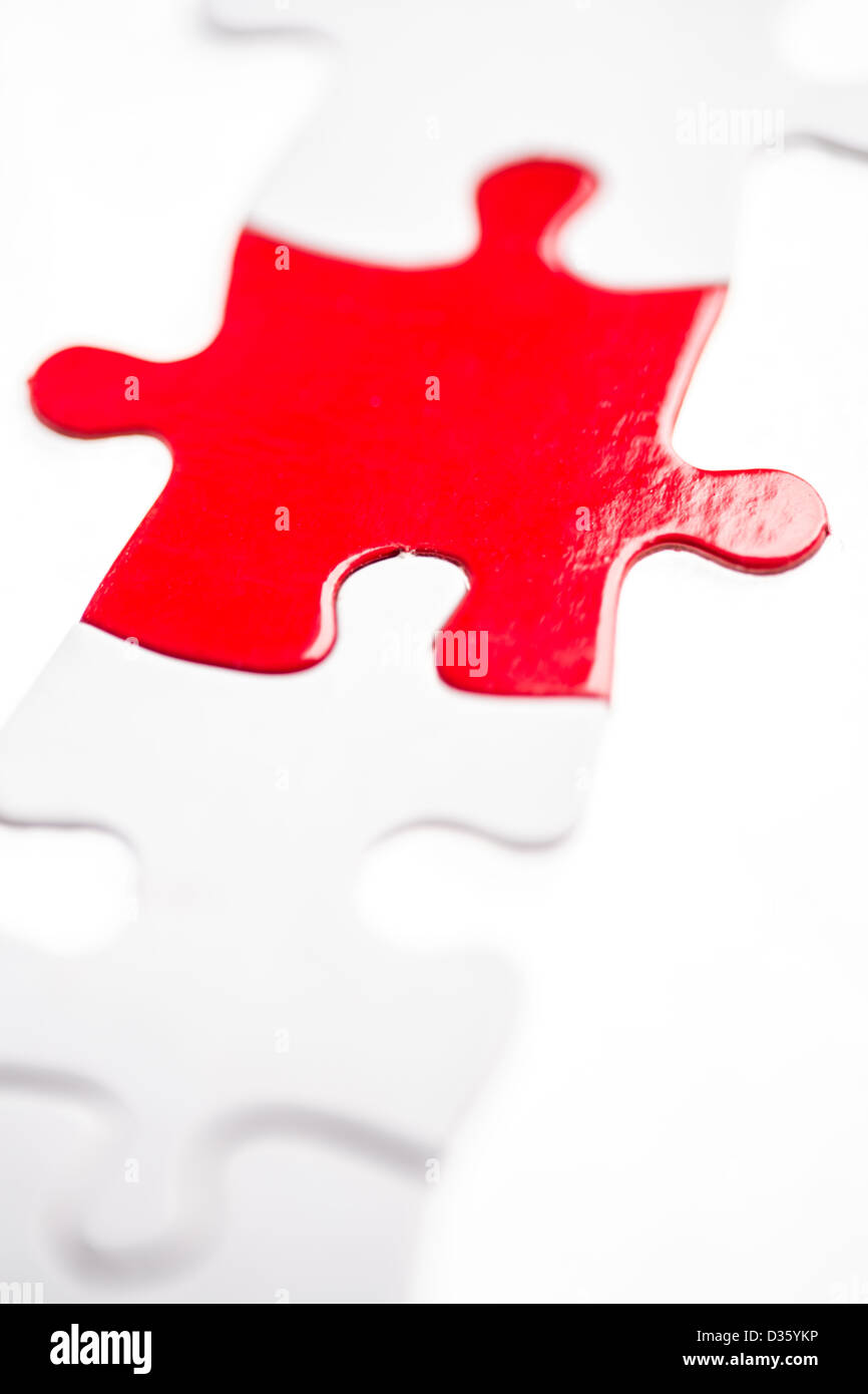 Red jigsaw piece Stock Photo - Alamy