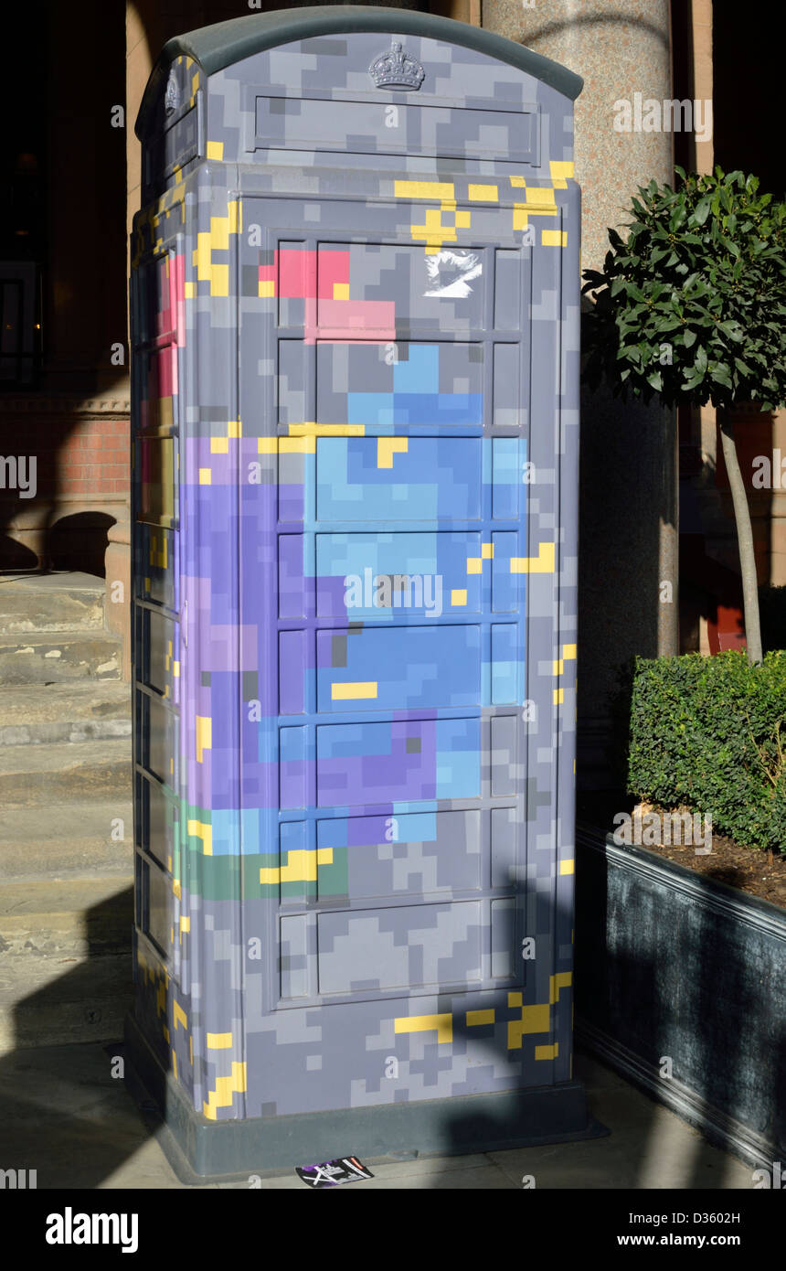 A traditional British telephone box painted in multiple colours Stock ...