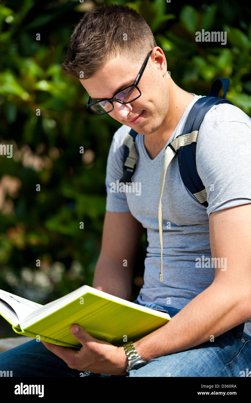 Student teen reading book smiling hi-res stock photography and images ...