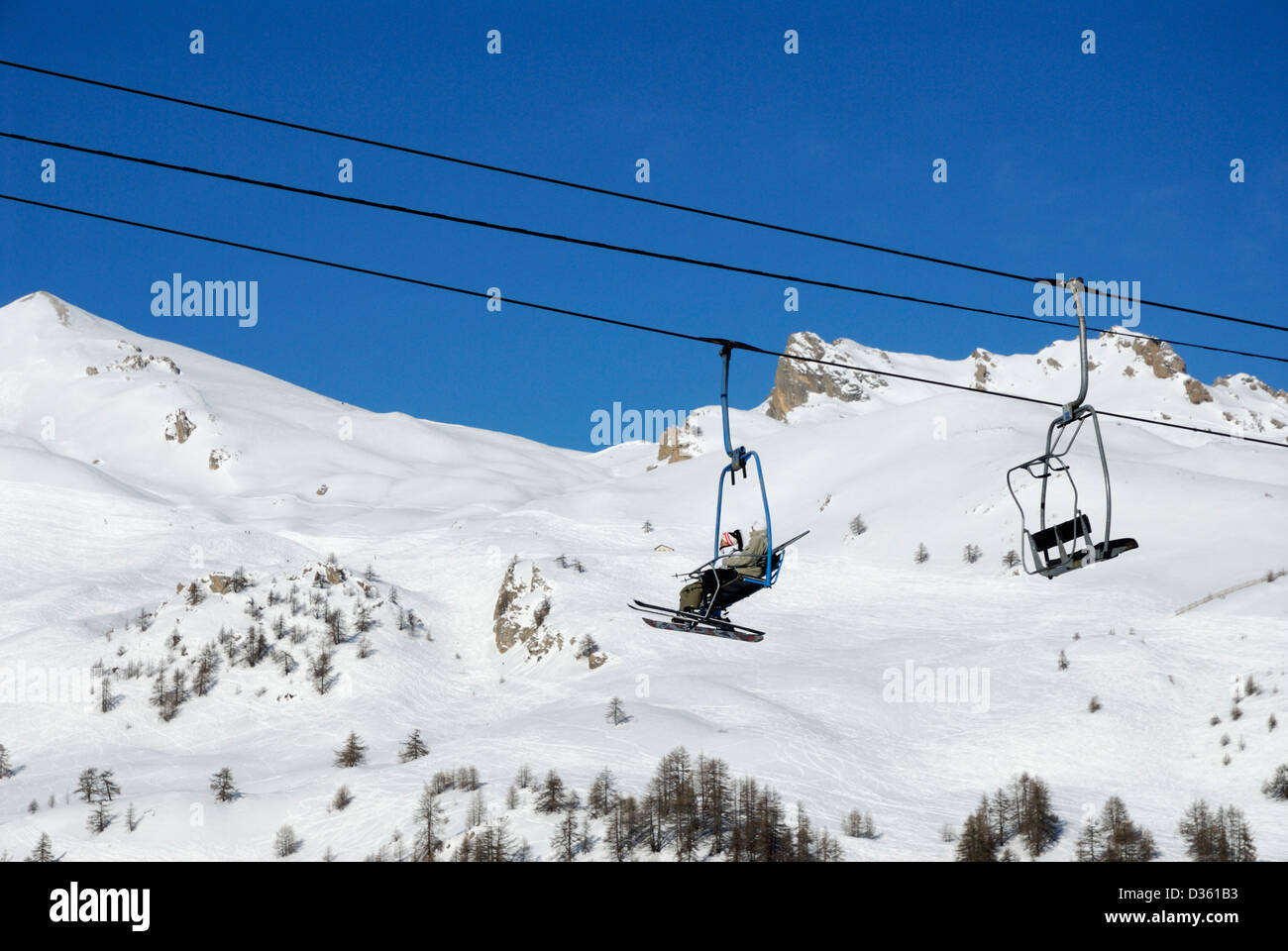 Chair lift, in the French ski resort Serre Chevalier located in the ...