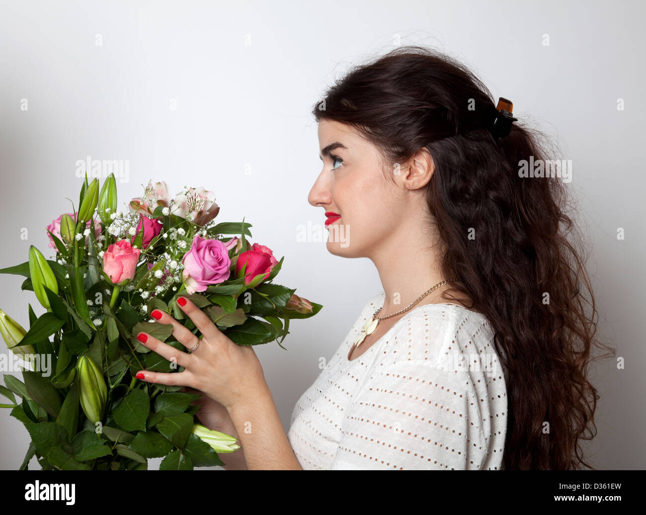 Woman accepting bunch of flowers Stock Photo - Alamy