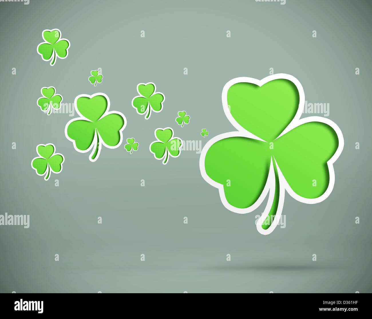Green shamrocks on grey background Stock Photo - Alamy