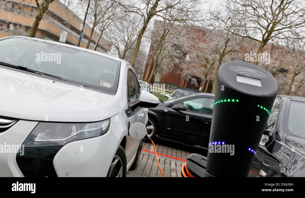 An electric car being recharged at a street charging station in Milton ...