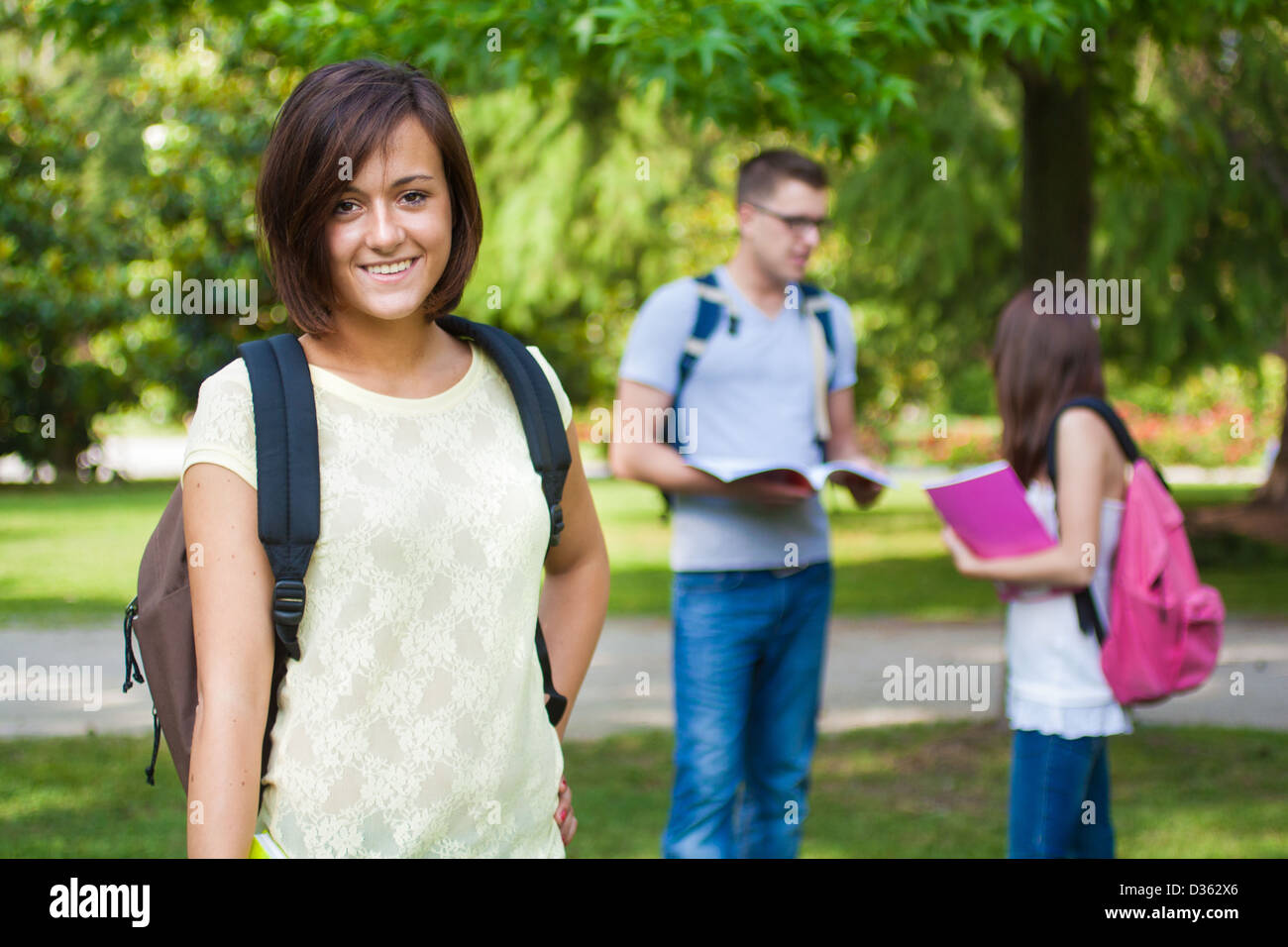 Outdoor portrait of a smiling student Stock Photo - Alamy
