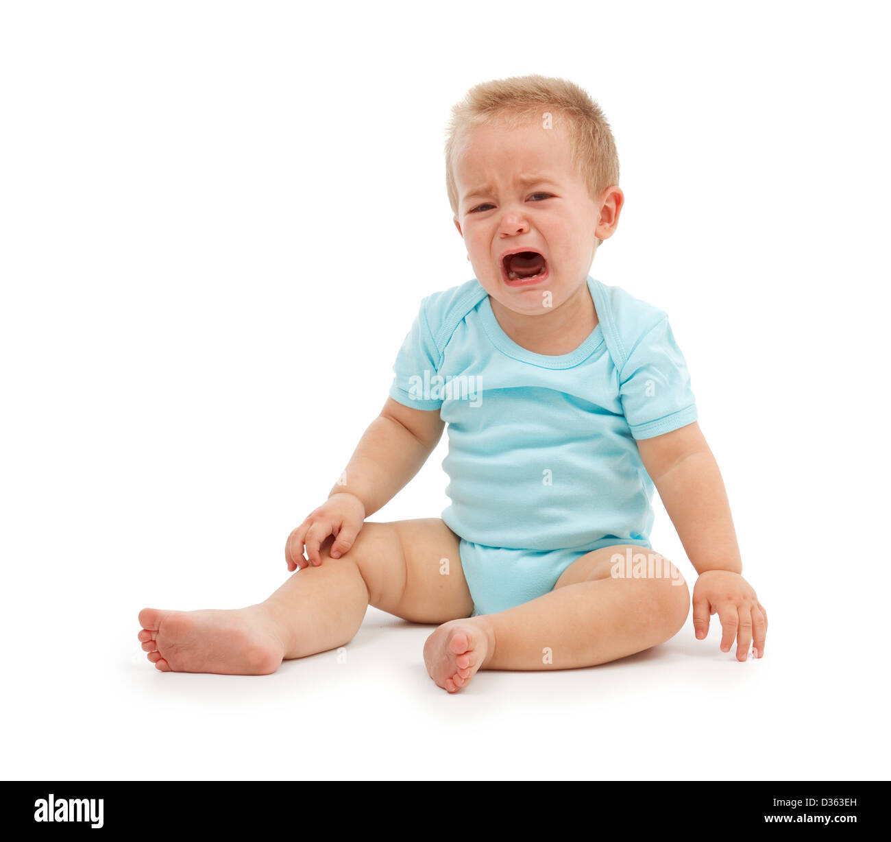 Sad baby boy sitting and crying Stock Photo - Alamy