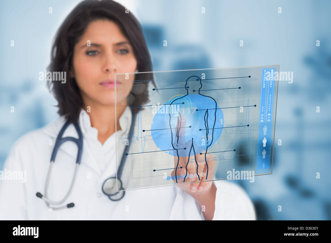 Serious female doctor touching a touchscreen Stock Photo - Alamy Serious female doctor touching a touchscreen Stock Photo - Alamy