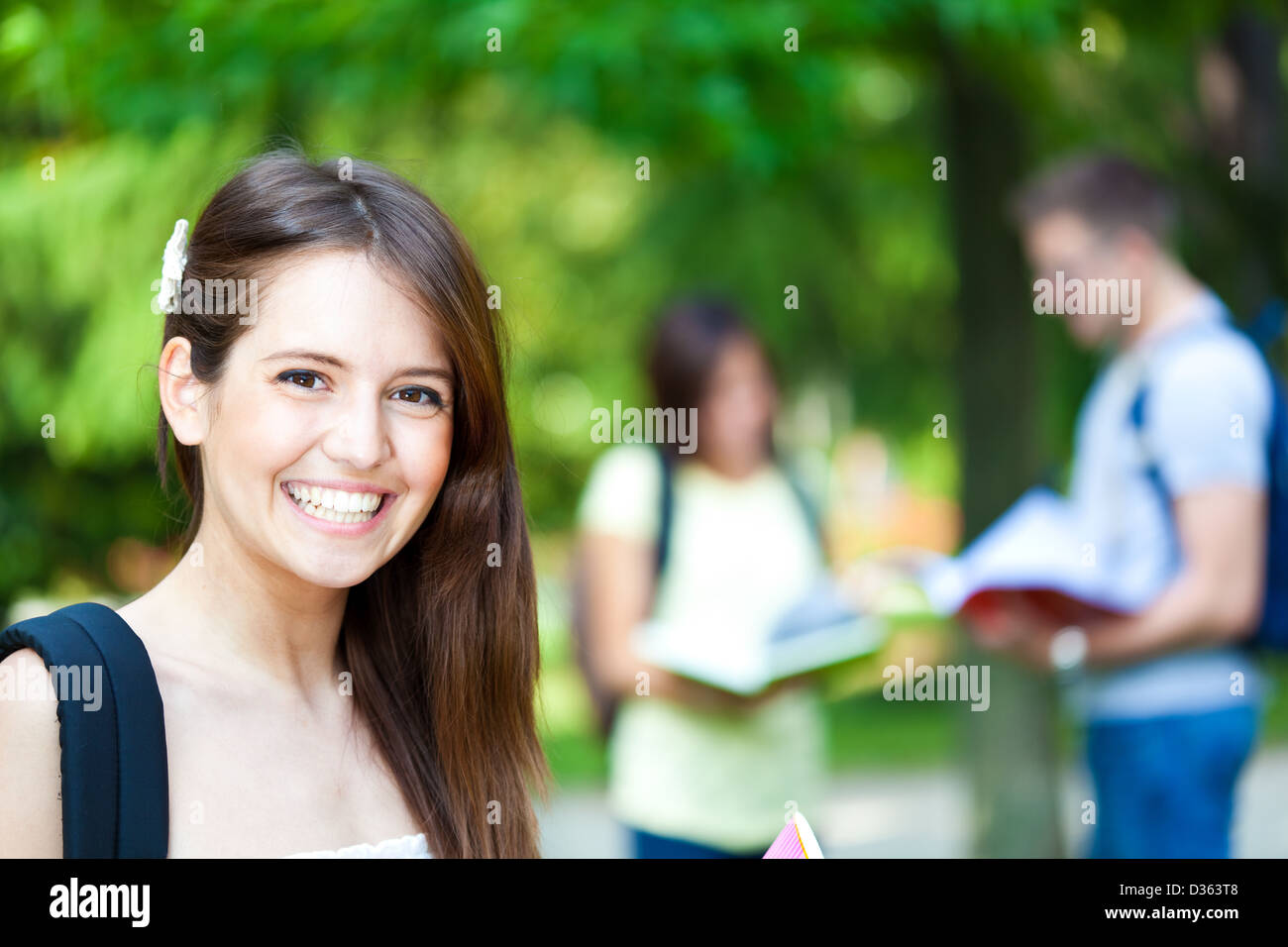 Outdoor portrait of a smiling student Stock Photo - Alamy