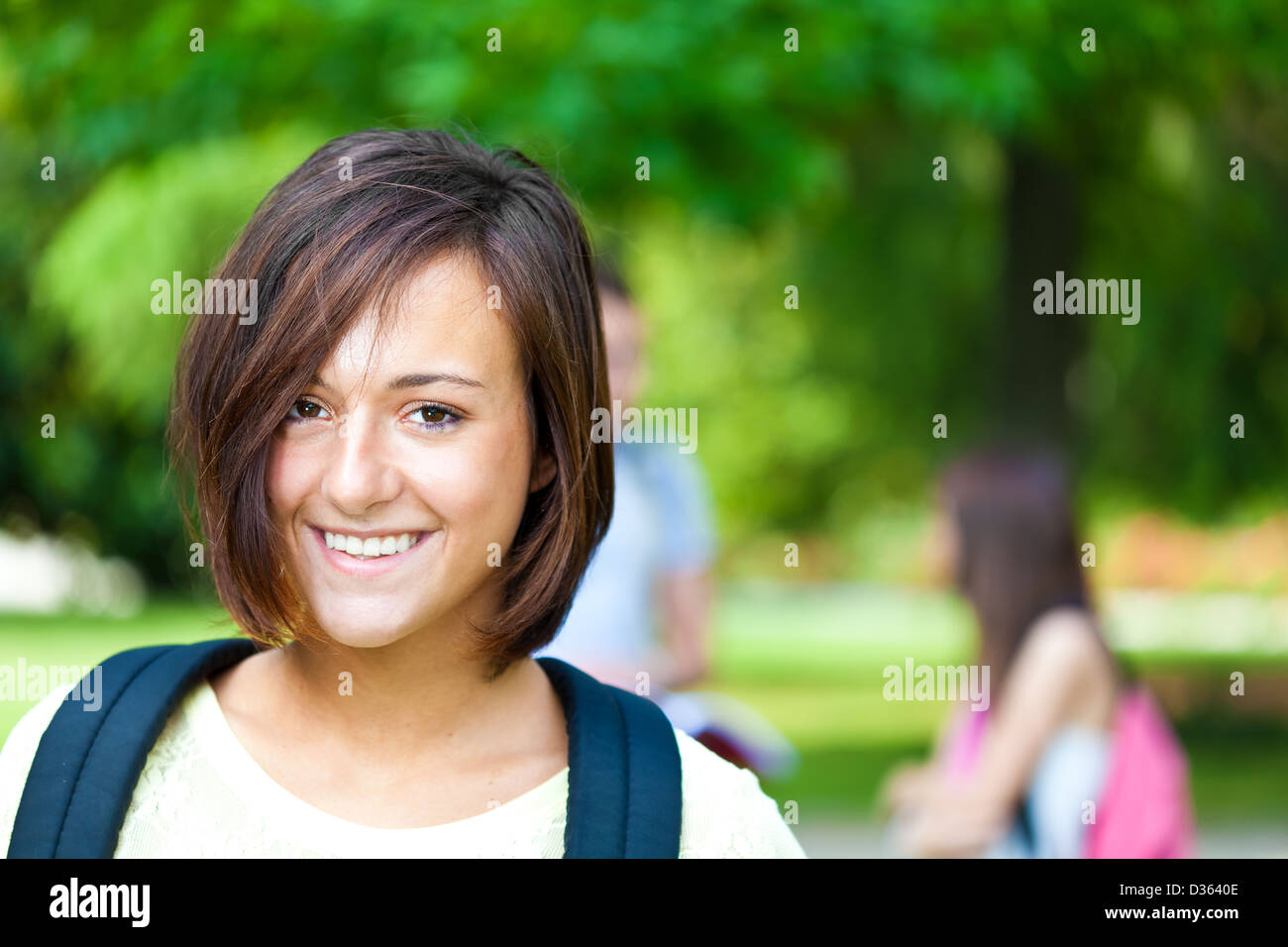 Outdoor portrait of a smiling student Stock Photo - Alamy