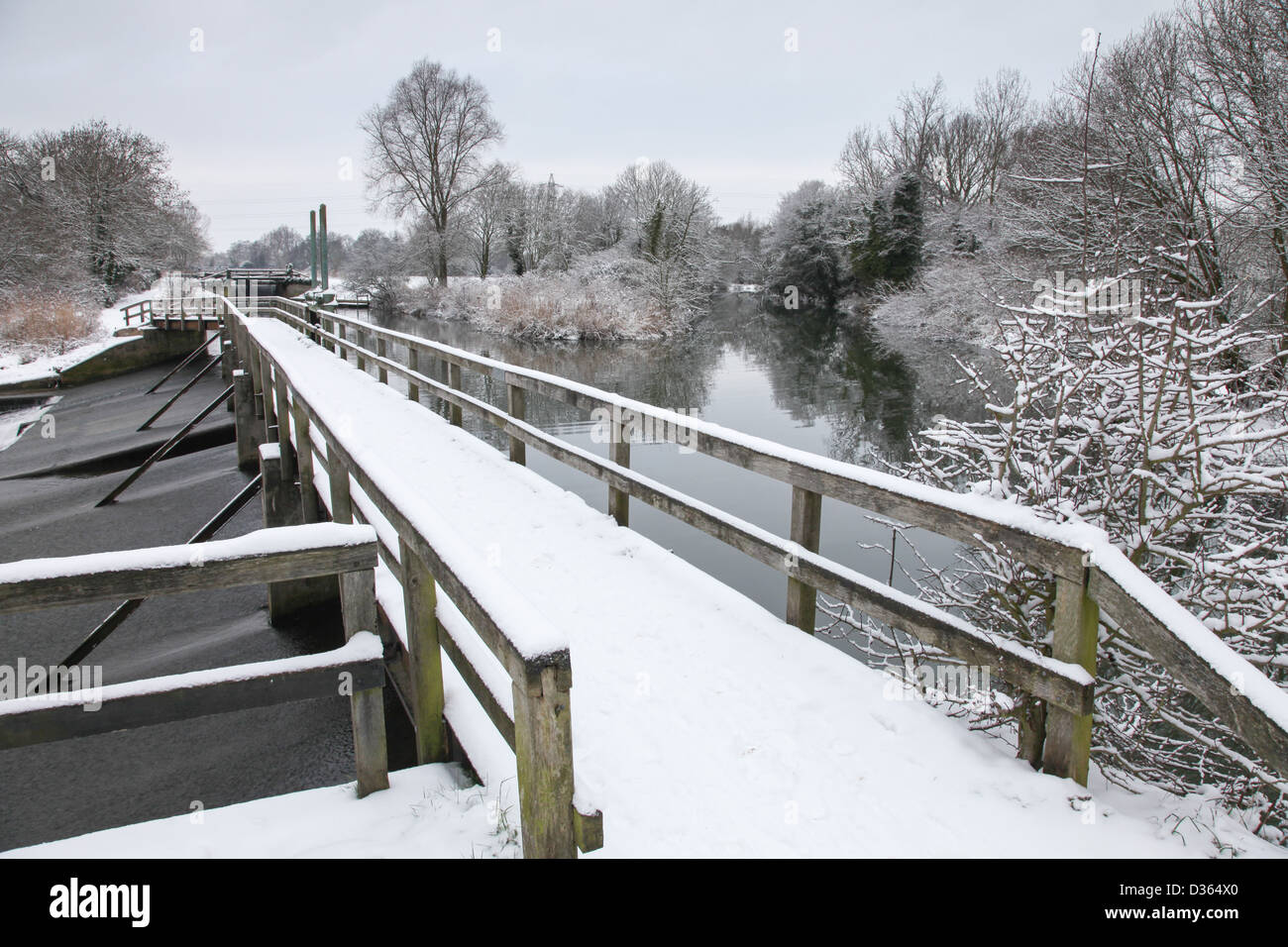 A wooden footbridge covered in snow on the Chelmer and Blackwater ...