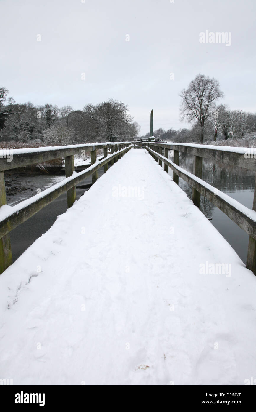 A wooden footbridge covered in snow on the Chelmer and Blackwater ...