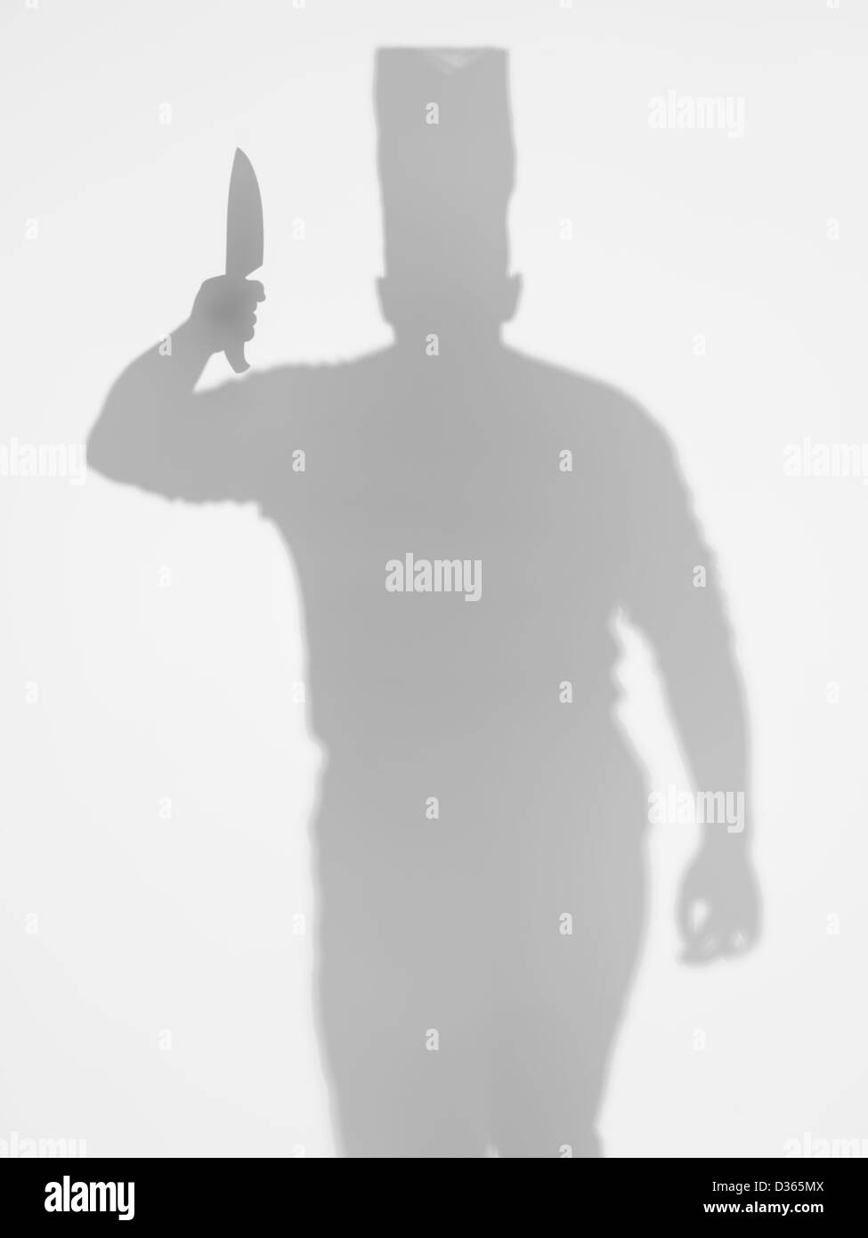 Man holding knife silhouette Black and White Stock Photos & Images - Alamy