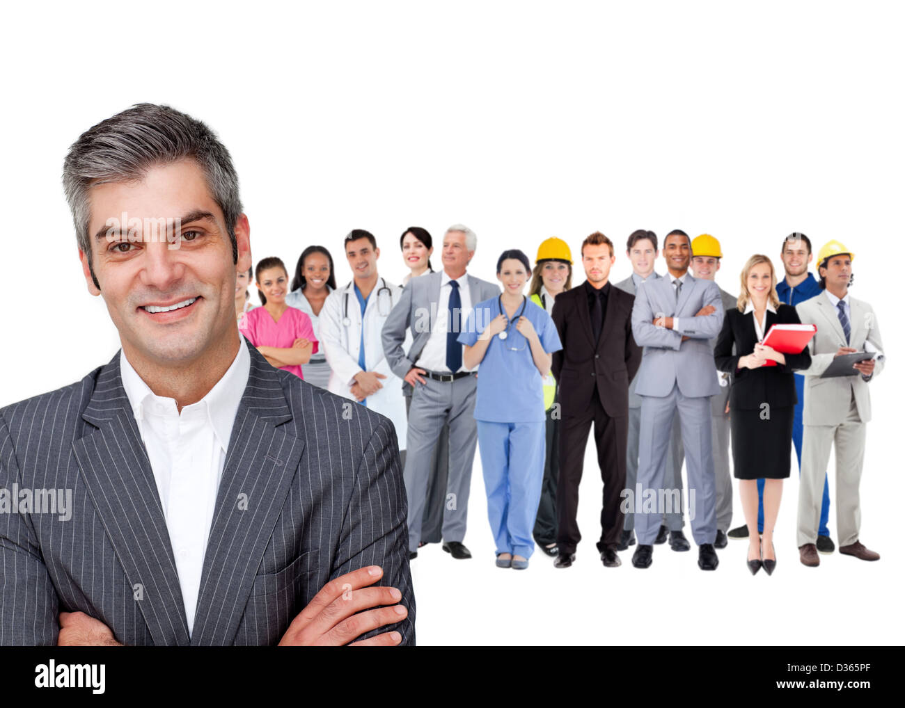 Smiling businessman ahead a group of people with different jobs Stock ...