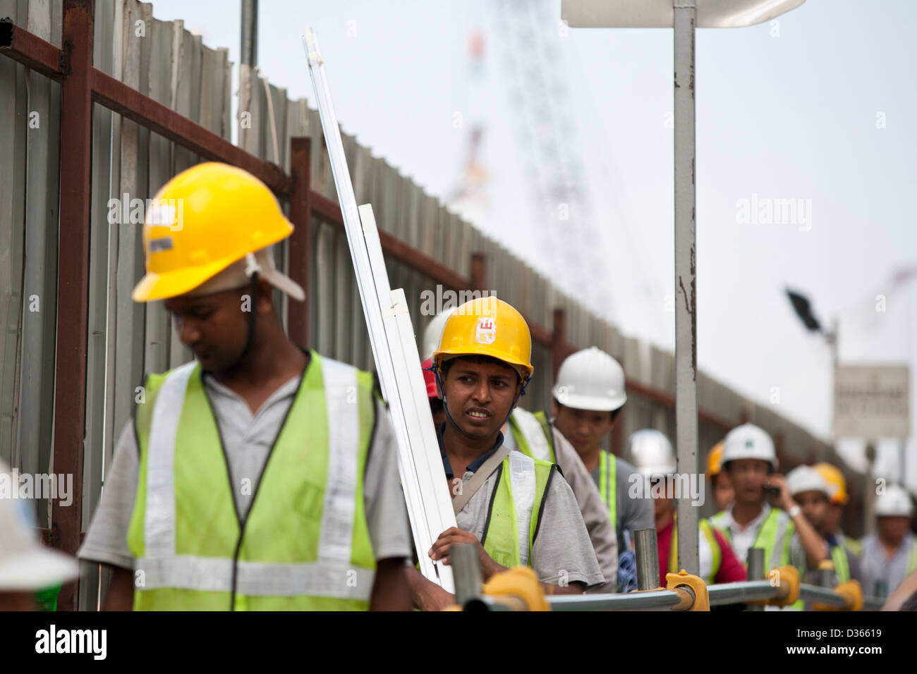 Migrant workers on the construction site of the Marina Bay Sands Resort ...