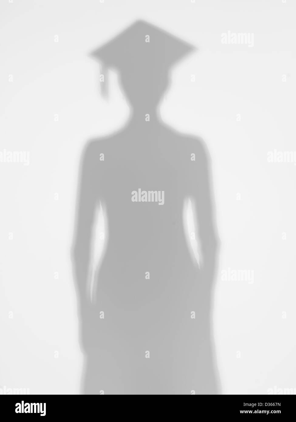 female graduating student standing behind a diffuse surface Stock Photo ...