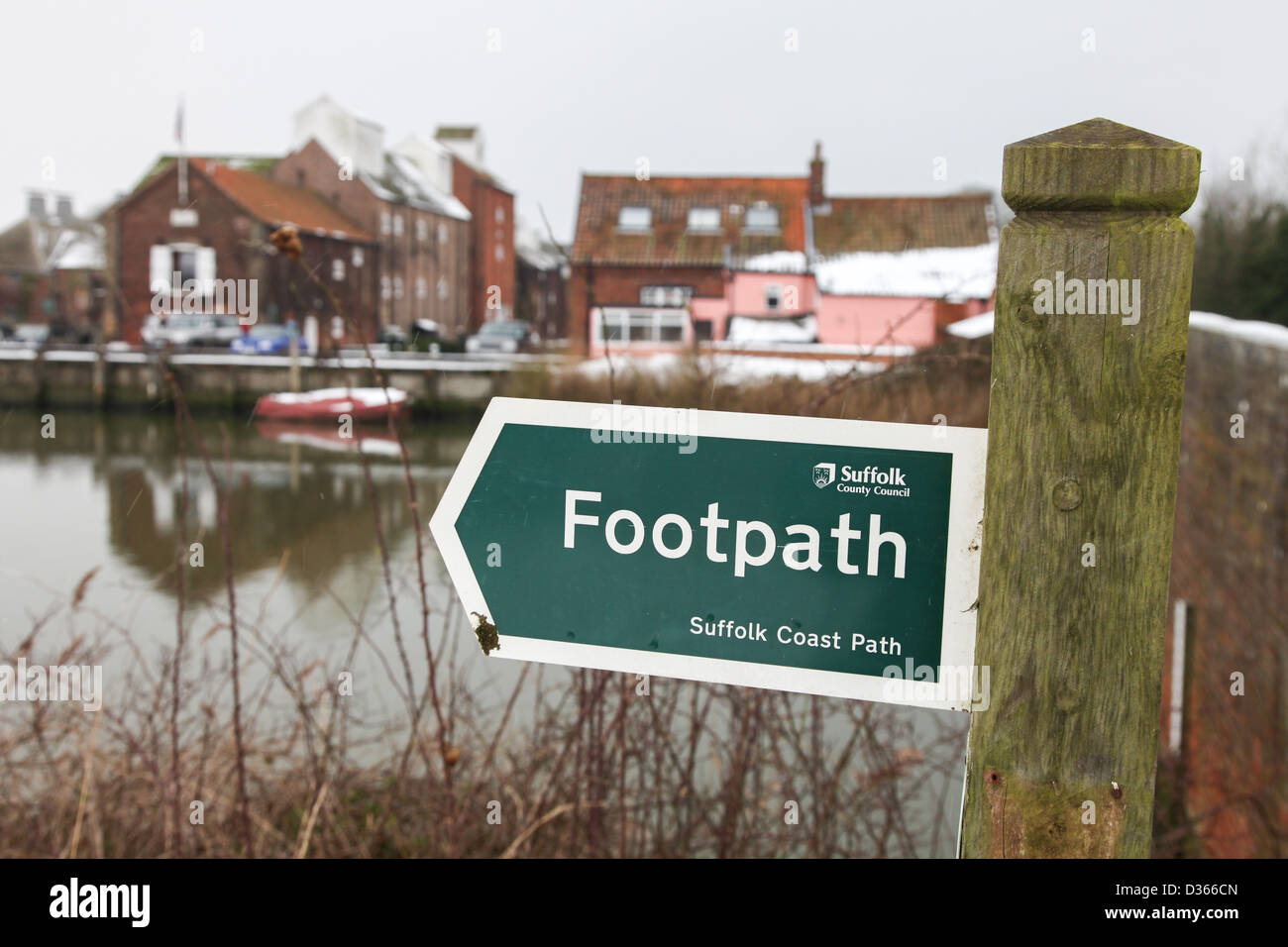 A footpath sign on the Suffolk Coast Path with Snape Maltings in the ...