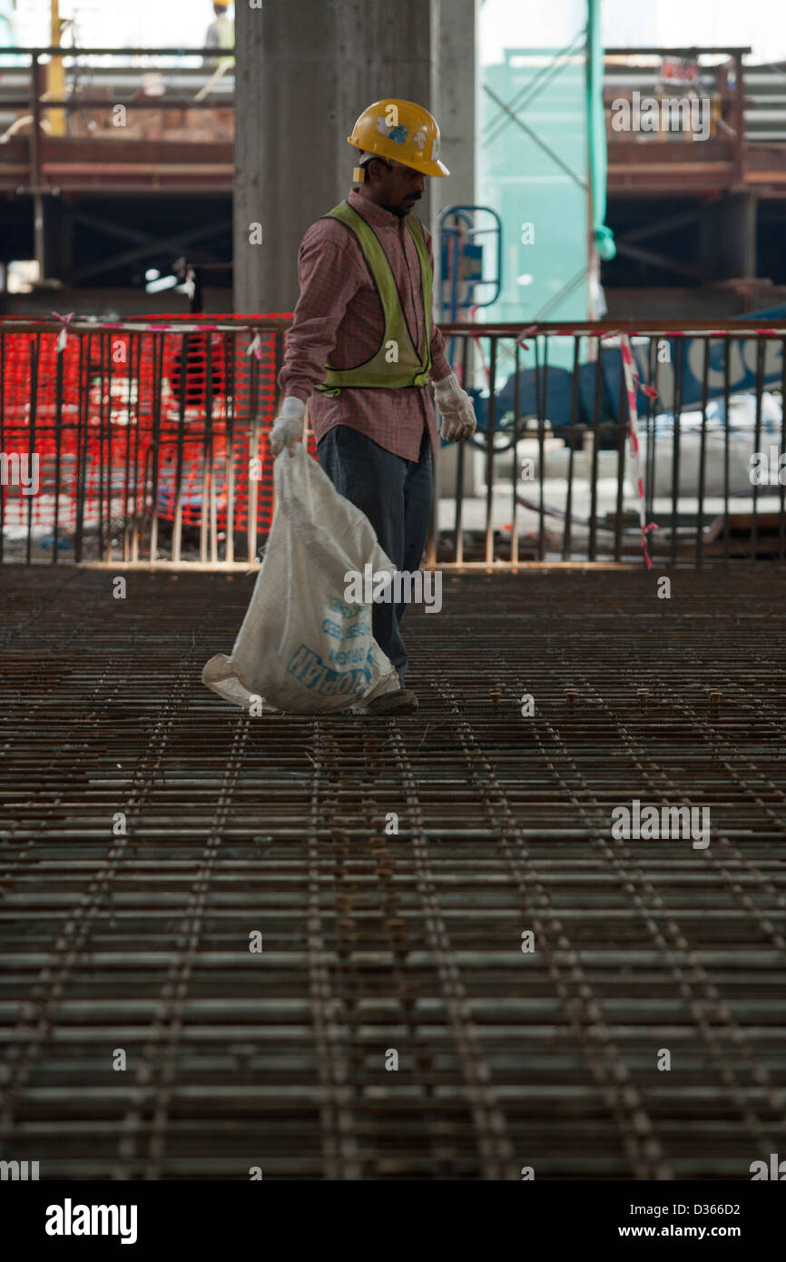 A Migrant worker on the construction site of the Marina Bay Sands ...