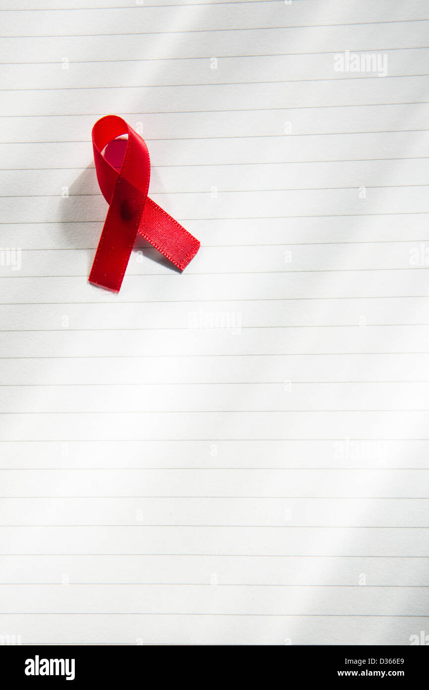 Awareness ribbon for aids on notepad Stock Photo - Alamy