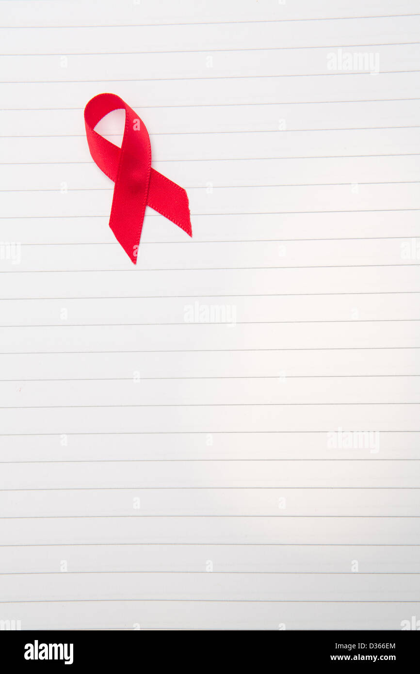 Awareness ribbon for aids on lined paper Stock Photo - Alamy
