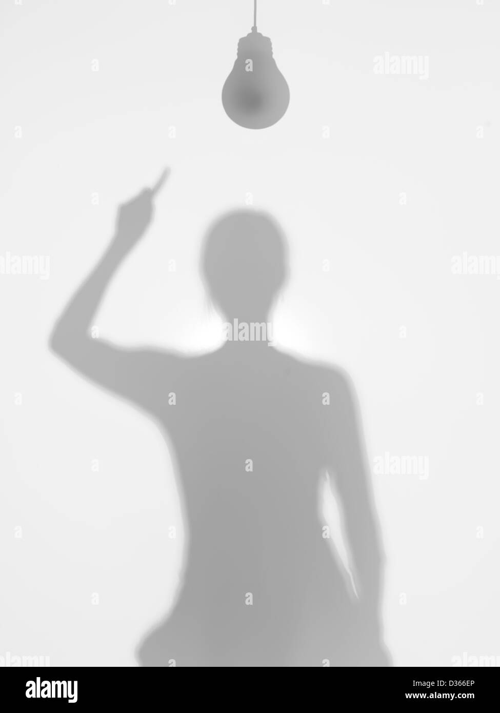 Light bulb symbol woman Black and White Stock Photos & Images - Alamy