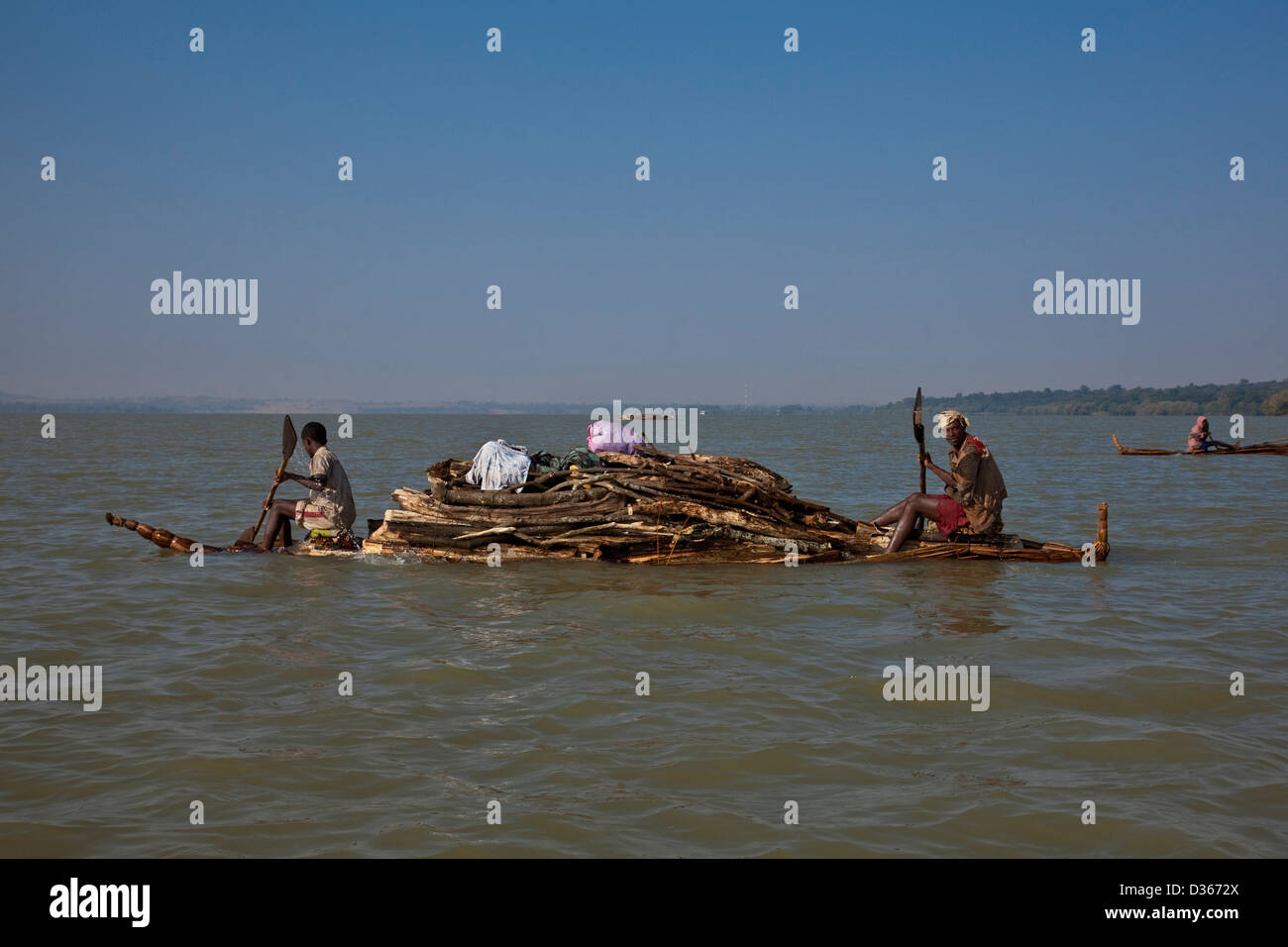 Local men transport wood across Lake Tana by Tankwa (Papyrus Boat ...
