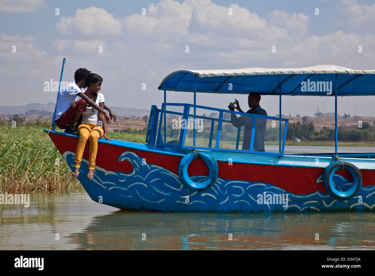A youngb Ethiopian couple pose for pictures on a boat, Lake Tana ...