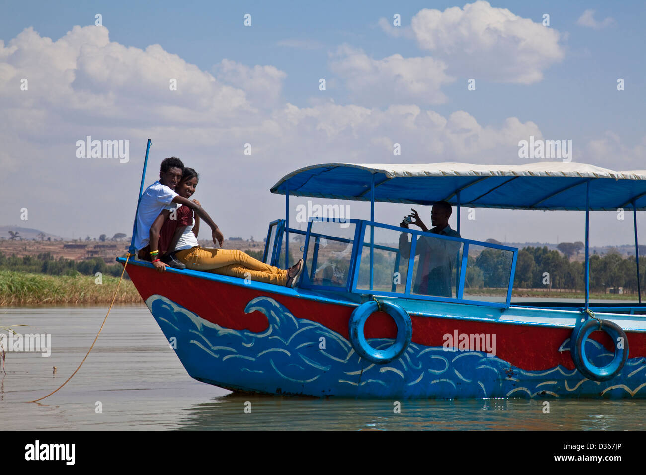 A young Ethiopian couple pose for pictures on a boat, Lake Tana ...