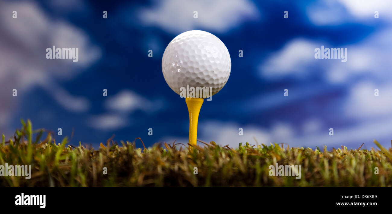 Playing golf, ball on tee Stock Photo - Alamy