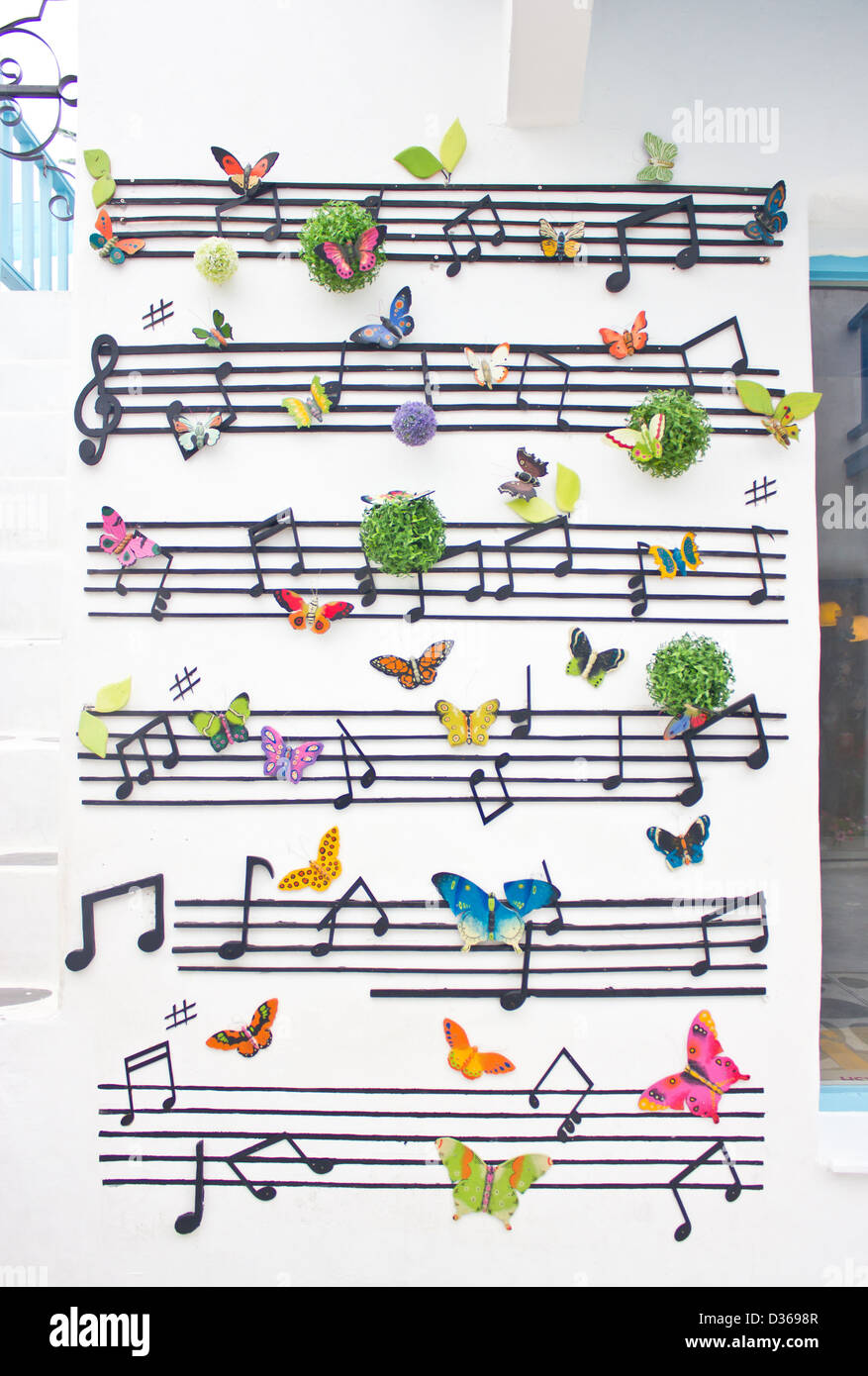Music notes with butterfly and bouquet decorating on the wall Stock ...