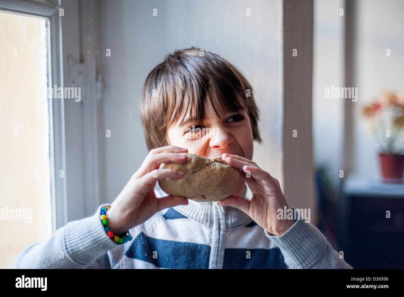 child eats a big bread Stock Photo - Alamy