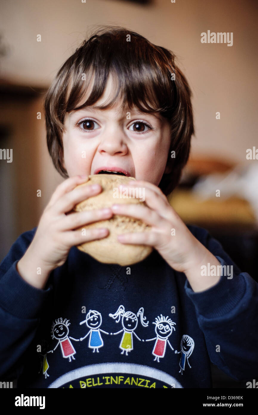 child eats a big bread Stock Photo - Alamy