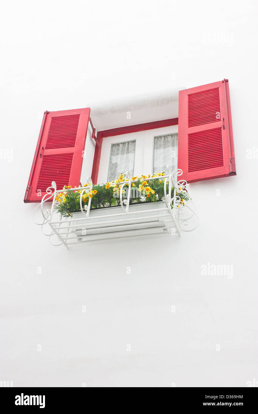 Opened red window with white wall Stock Photo - Alamy