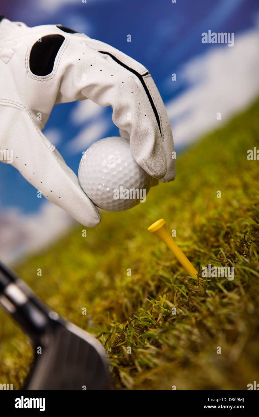 Hand and golf ball Stock Photo - Alamy