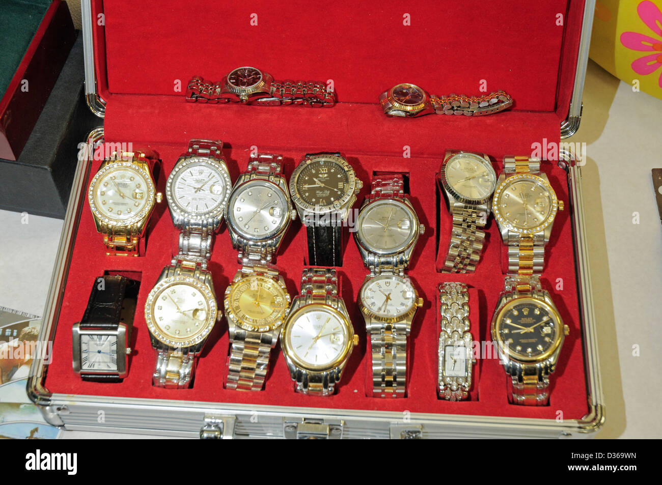 A sample of fake watches on display to warn the unwary Stock Photo - Alamy