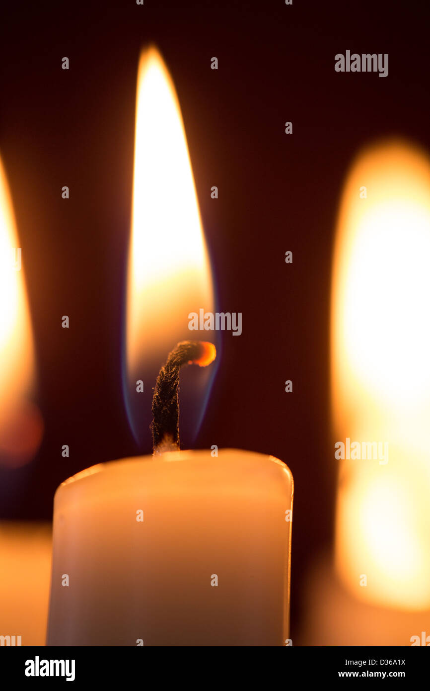 Close up of lit candle Stock Photo - Alamy