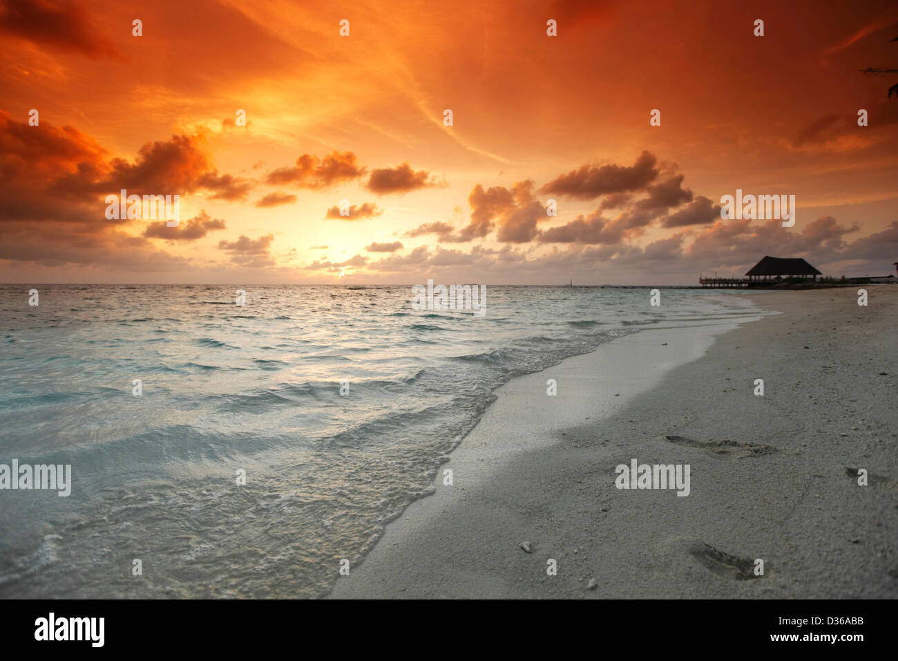 Beautiful view of sea and empty beach on sunset Stock Photo - Alamy