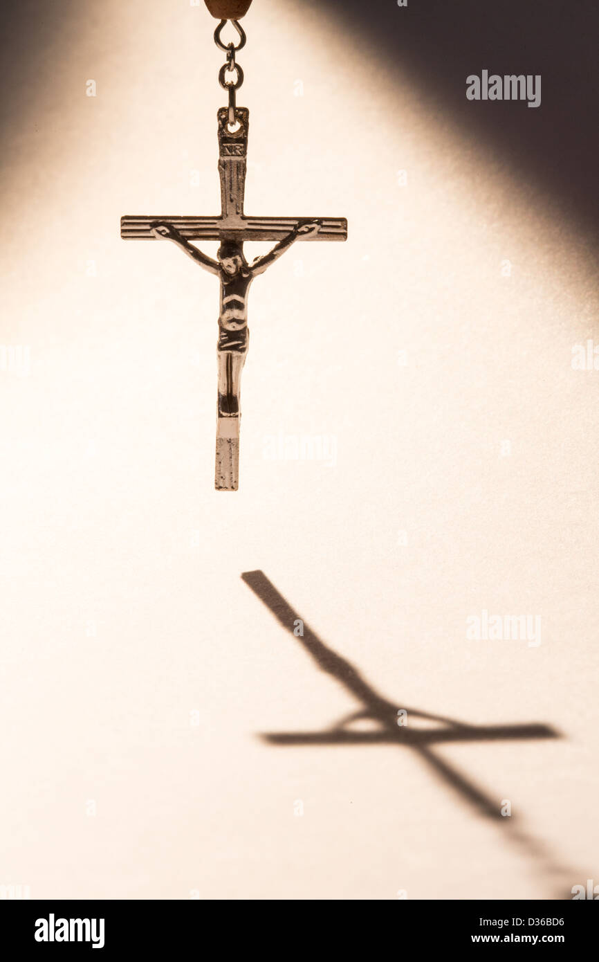 Cross casting a shadow Stock Photo - Alamy