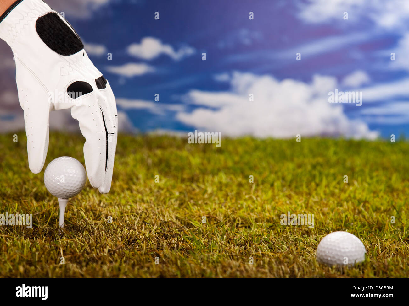 Hand and golf ball Stock Photo - Alamy