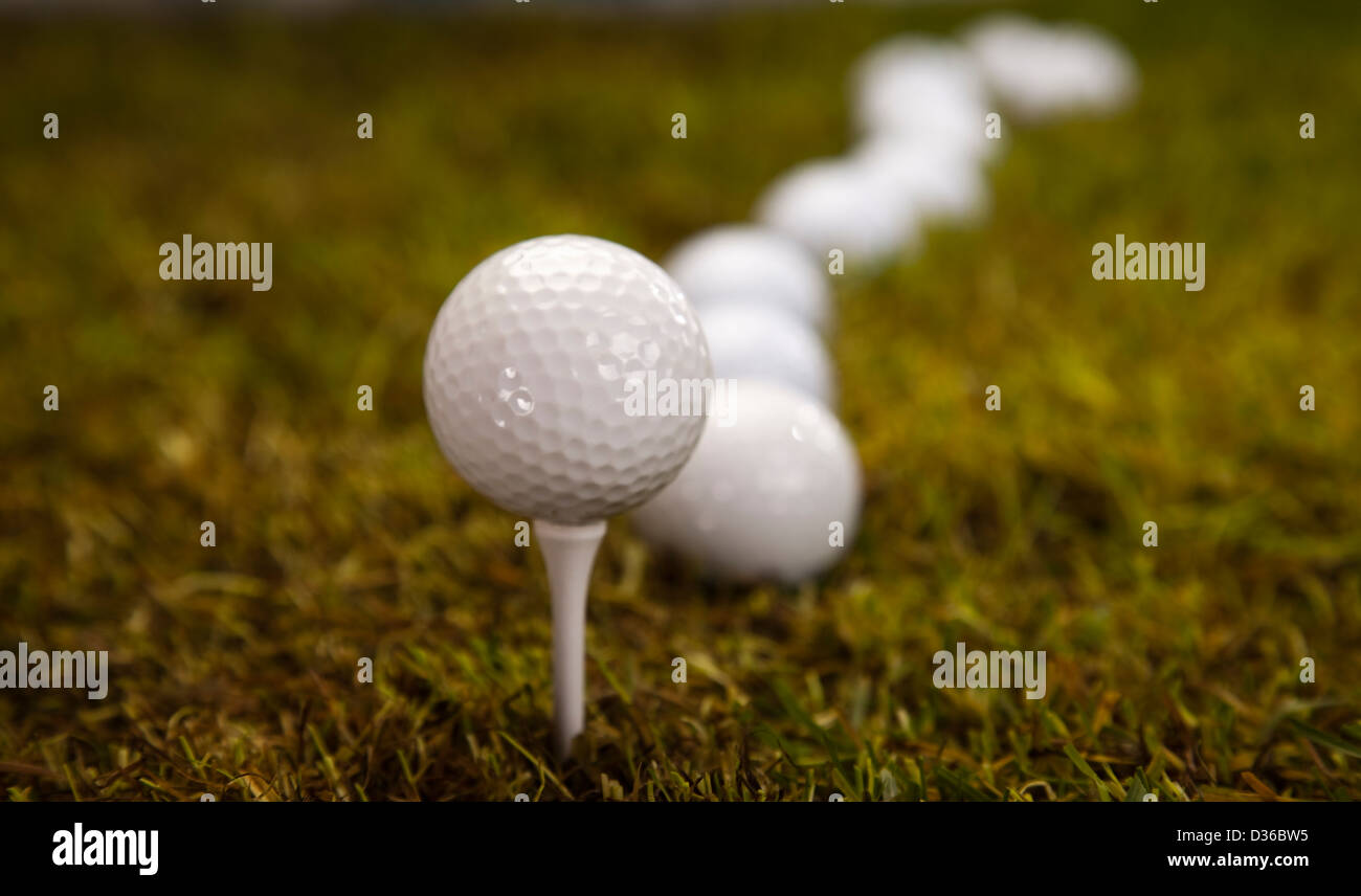 Golf ball on tee Stock Photo - Alamy