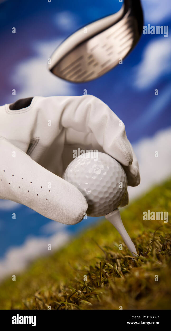 Playing golf, ball on tee Stock Photo - Alamy