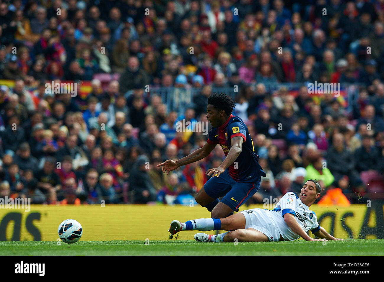 Alex Song (FC Barcelona) duels for the ball against Barrada (Getafe CF ...