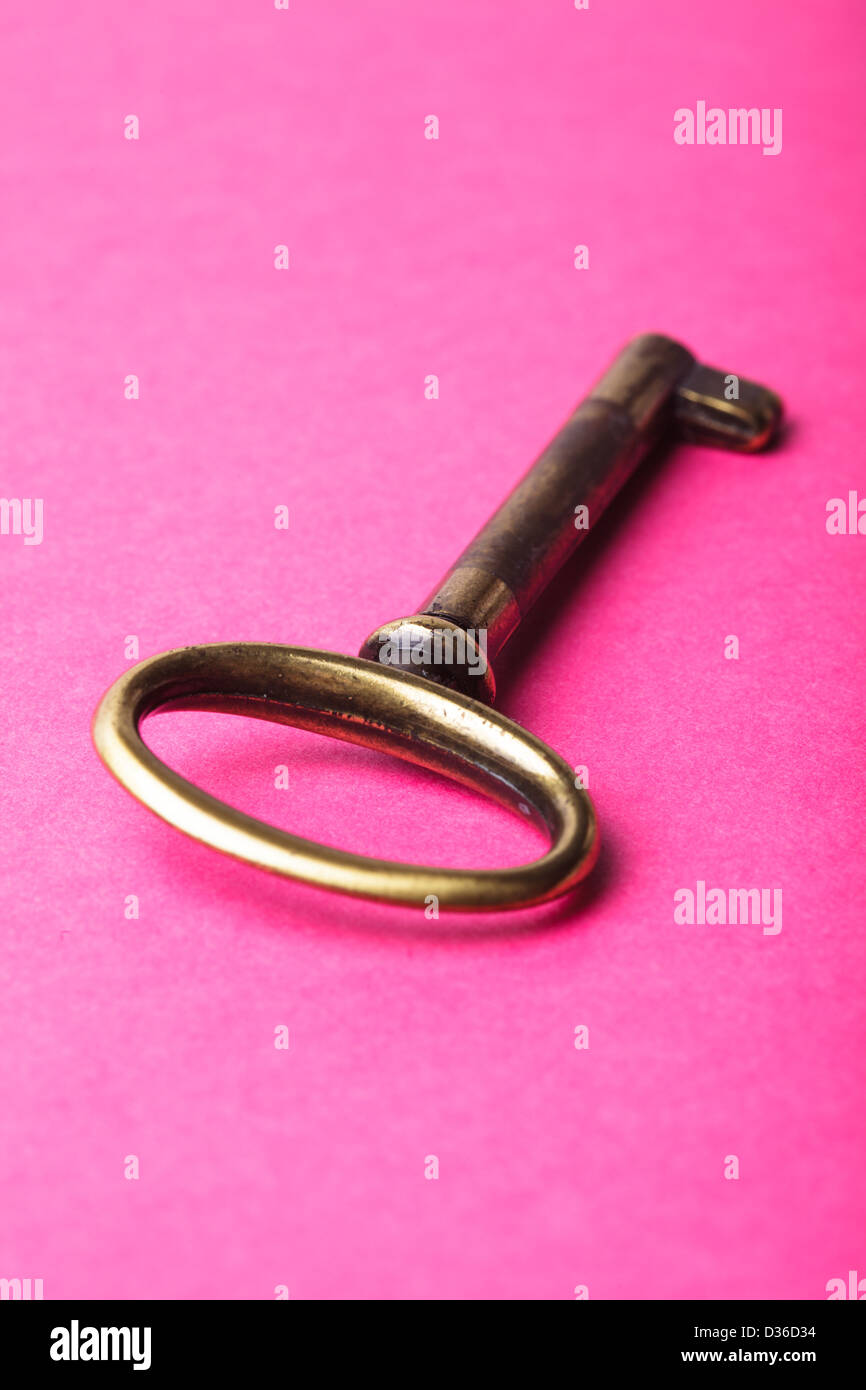Key to Success on pink background closeup Stock Photo - Alamy