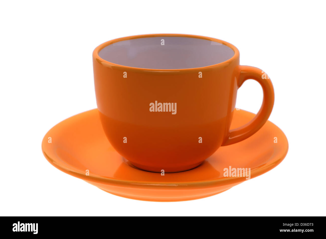 orange cup and saucer isolated on a white background Stock Photo - Alamy