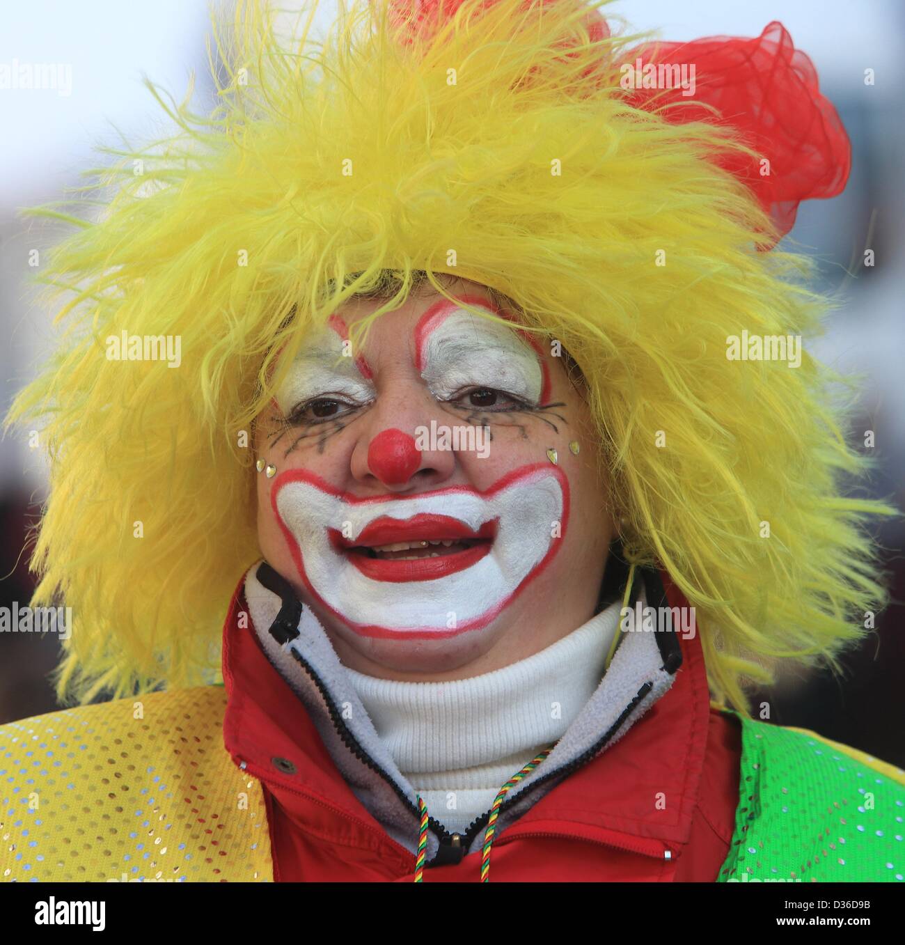 A woman dressed as a cloun takes part in the carnival parade in Koethen ...