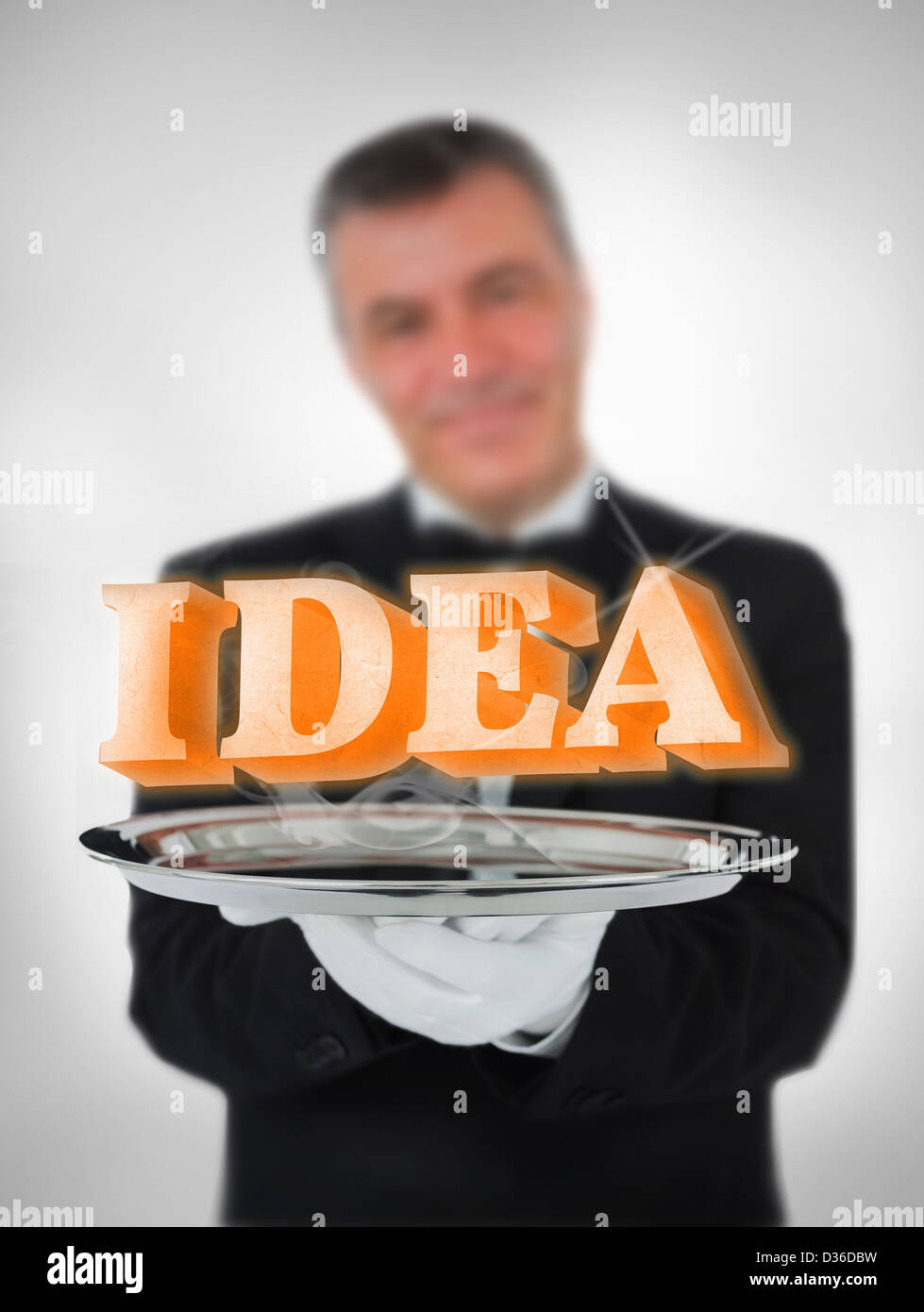Smiling waiter offering ideas Stock Photo - Alamy
