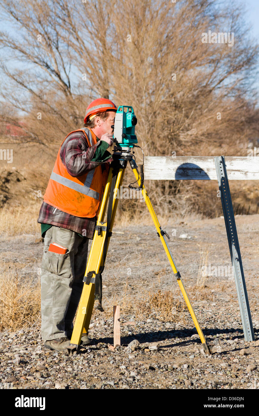 Land surveyors measuring existing railroad bridge in rural area Stock ...