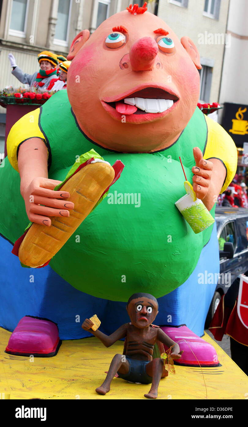 A float shows a fat man saying "I don't see any poverty" in the Rose ...